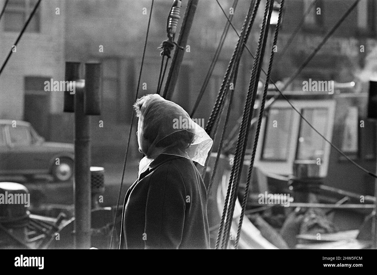 A relative waits at the fish dock for any news. The fishing industry in ...