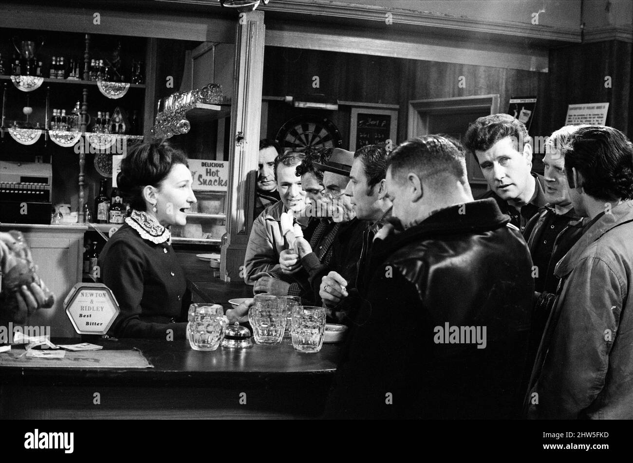 The cast of 'Coronation Street' on set. Eileen Derbyshire behind the ...