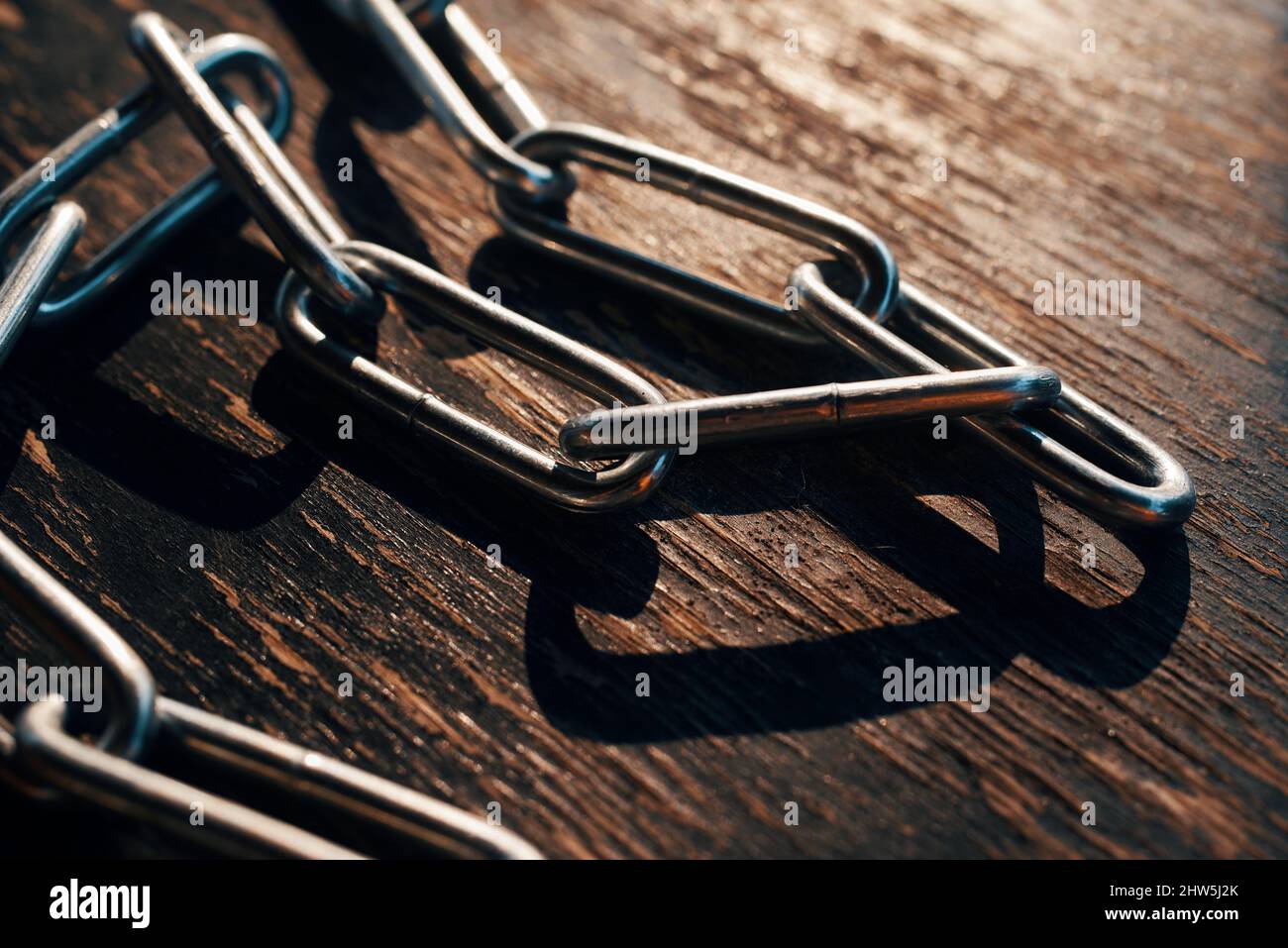 The chain on an old wood background Stock Photo - Alamy