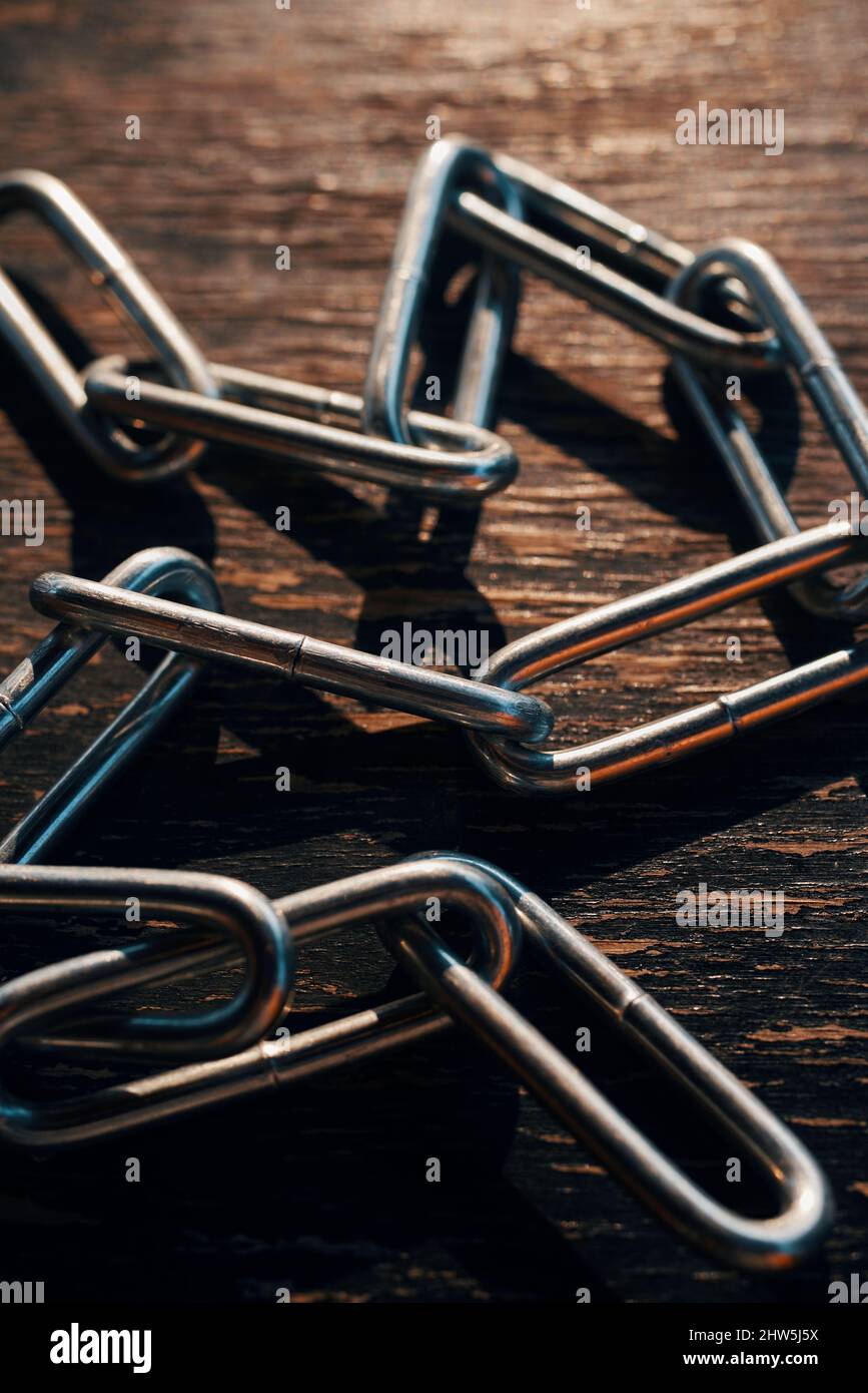 The chain on an old wood background Stock Photo - Alamy