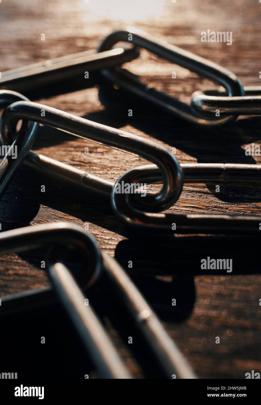The chain on an old wood background Stock Photo - Alamy