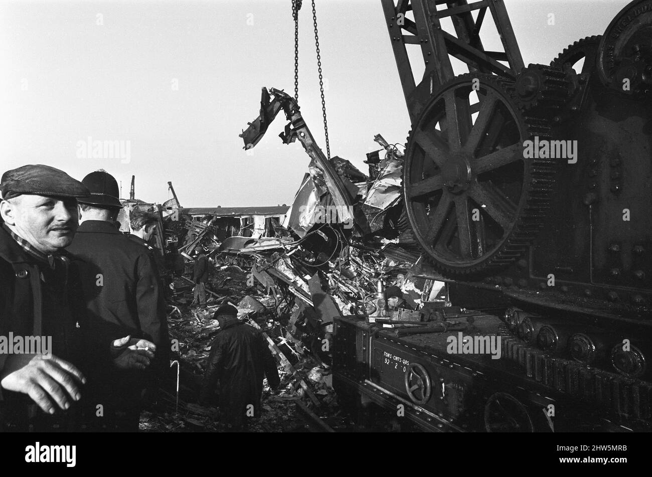 Heavy lifting gear is brought in to clear the wreckage of the Hixon ...