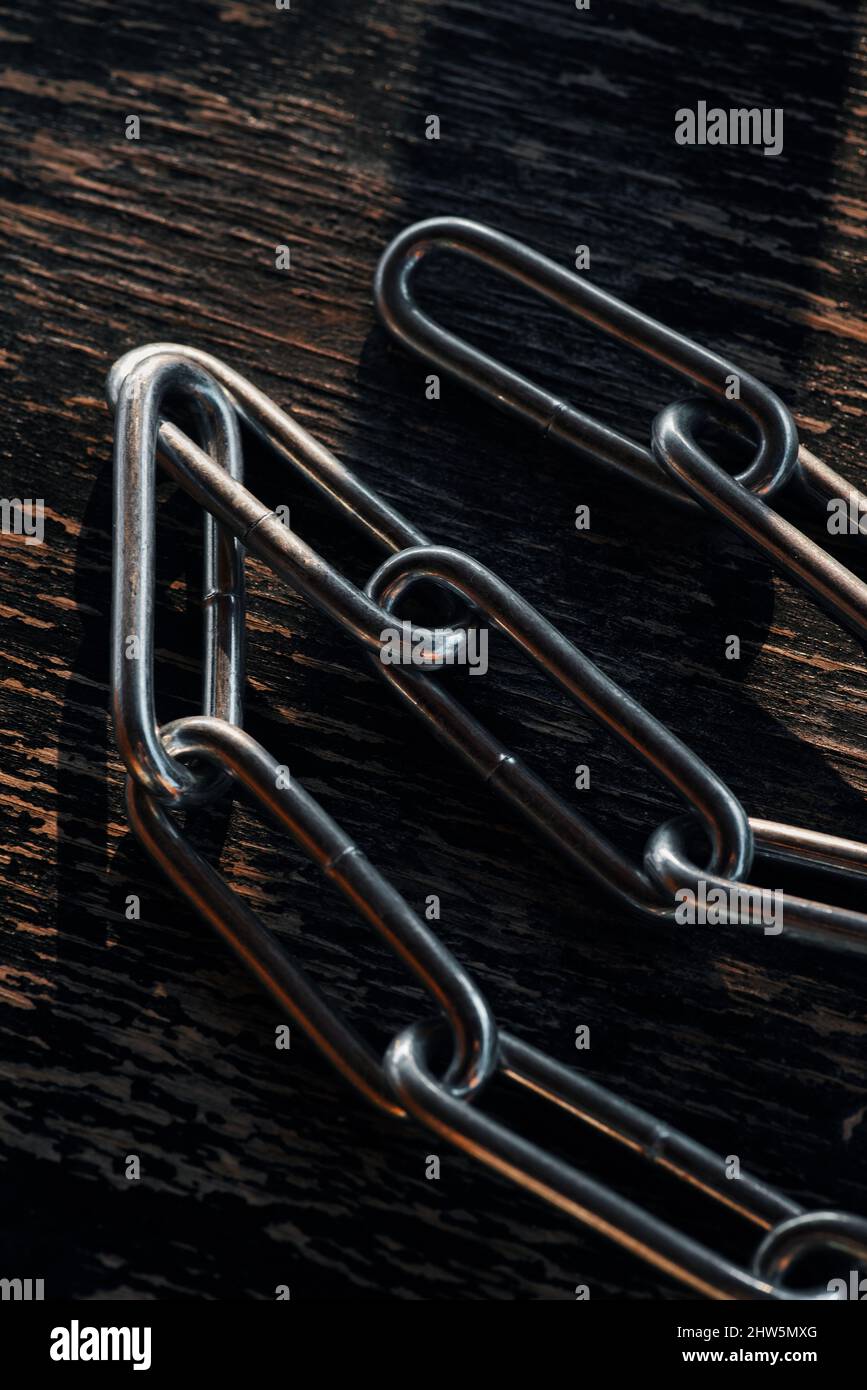 The chain on an old wood background Stock Photo - Alamy