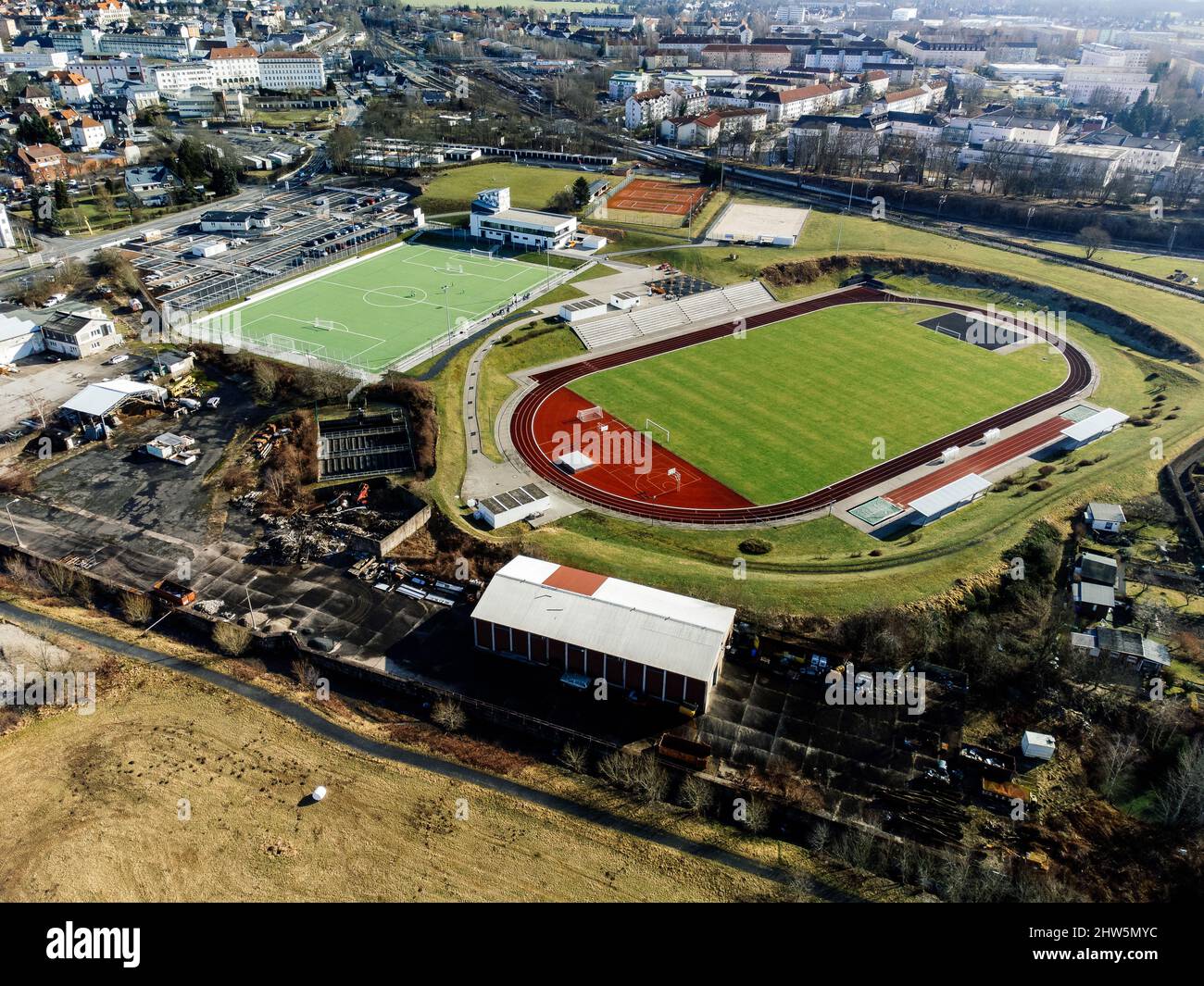 Drone shot of a football stadium and buildings in the city of Sonneberg ...