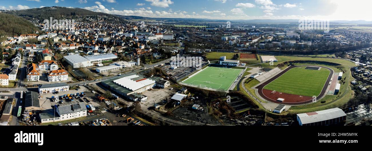 Drone shot of a football stadium and buildings in the city of Sonneberg ...