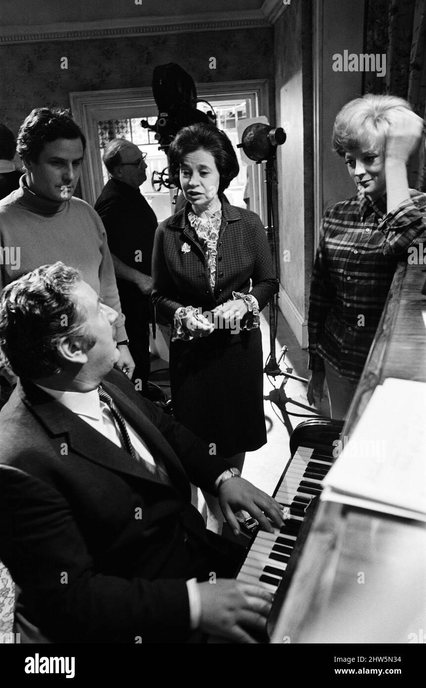 The filming of MGM's comedy 'Hot Millions'. Pictured seated at the ...