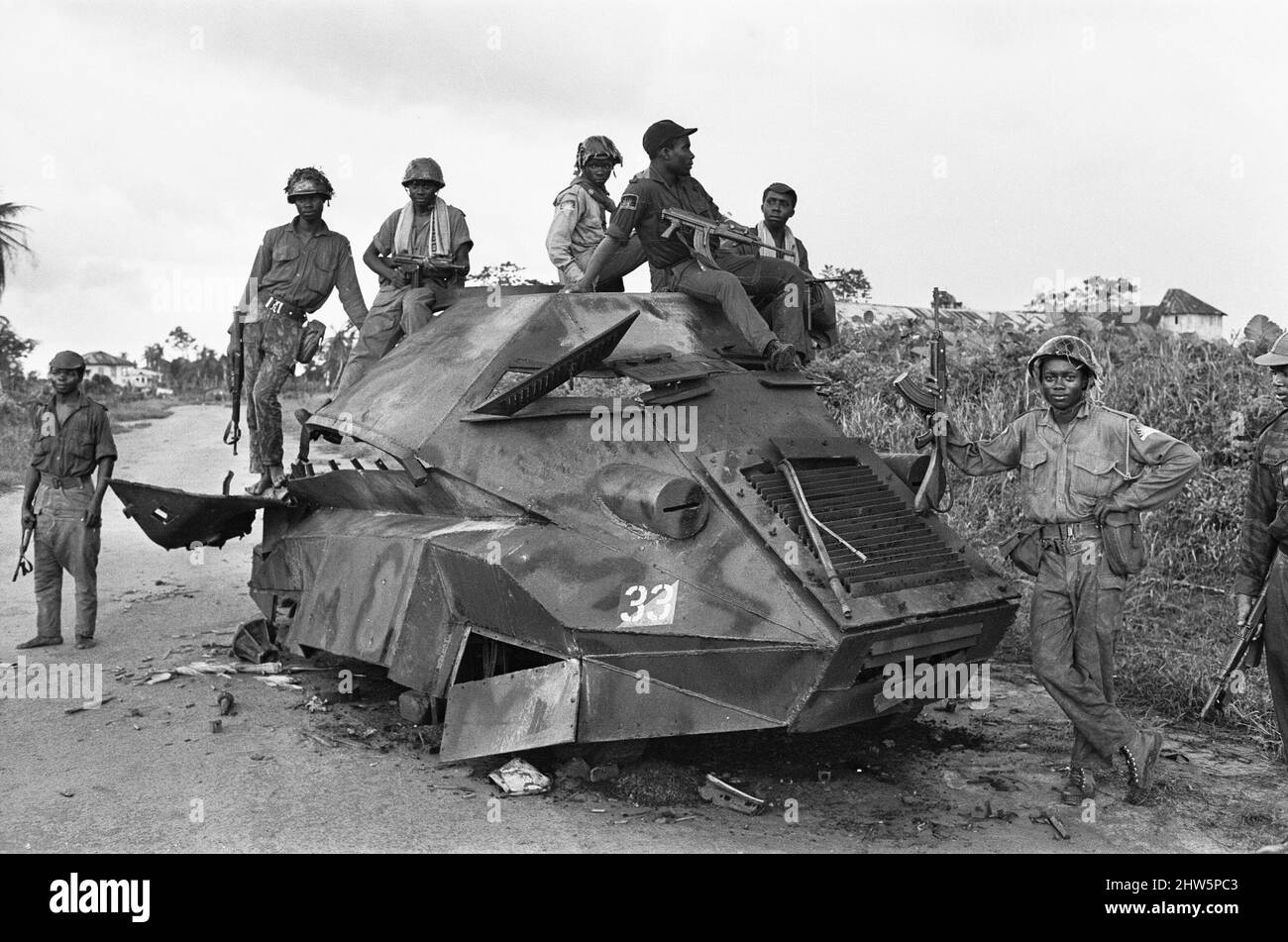 A Biafran soldiers seen here sitting on a destroyed Nigerian army ...
