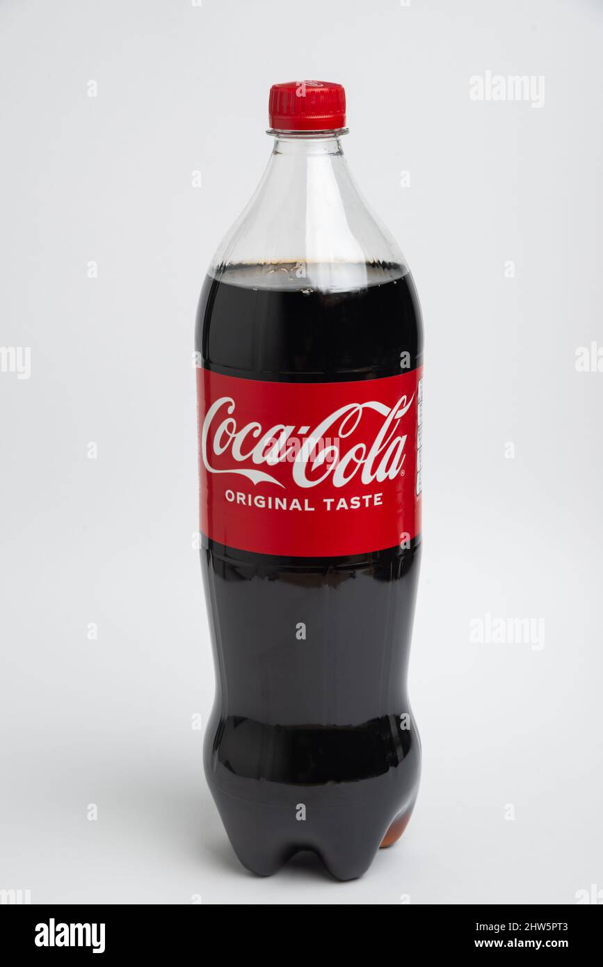 Vertical shot of Coca Cola plastic bottle isolated on white background ...