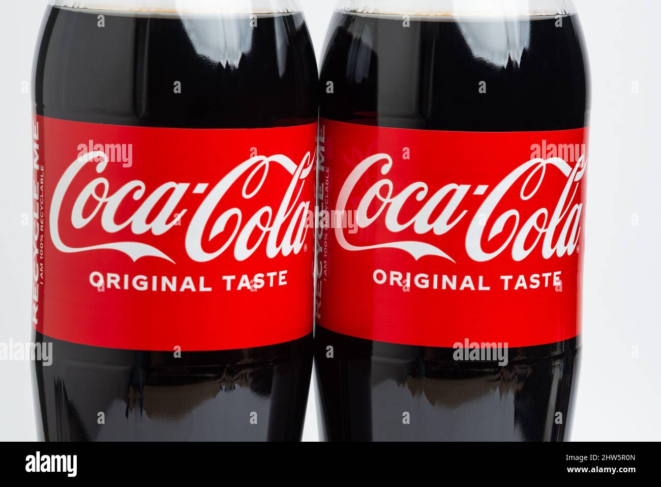 Closeup shot of Coca Cola plastic bottles isolated on white background ...