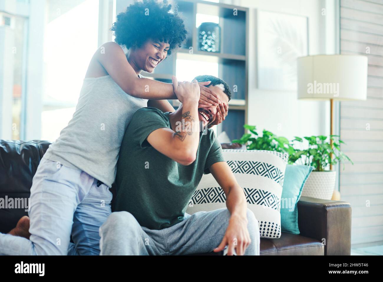 Ill let go if youll cuddle with me. Shot of a woman covering her ...