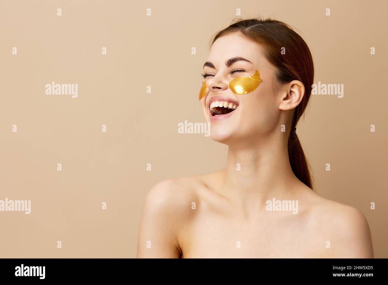 woman golden patches on the face isolated background Stock Photo - Alamy