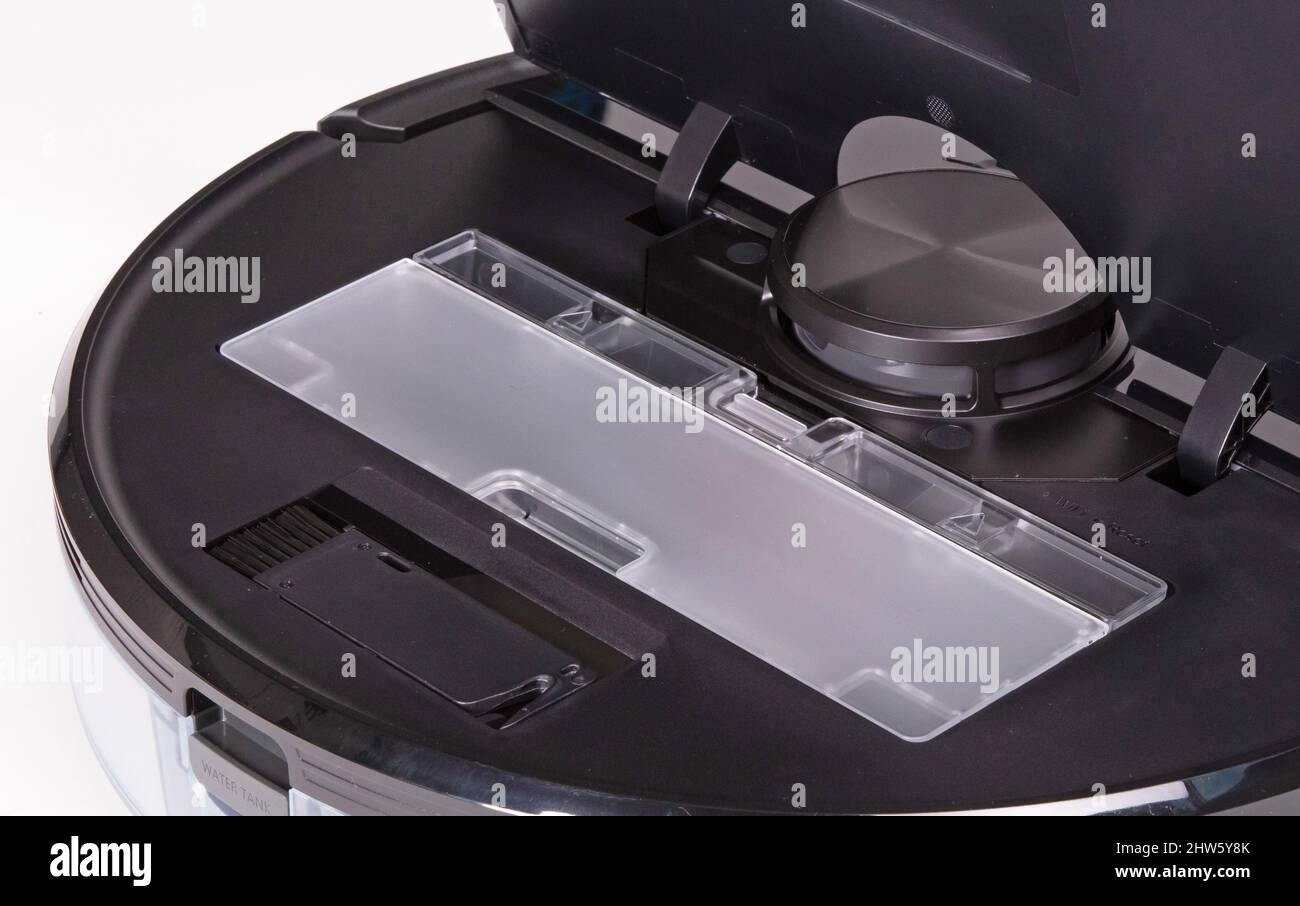 Robot vacuum cleaner on a white floor, dustbin Stock Photo - Alamy