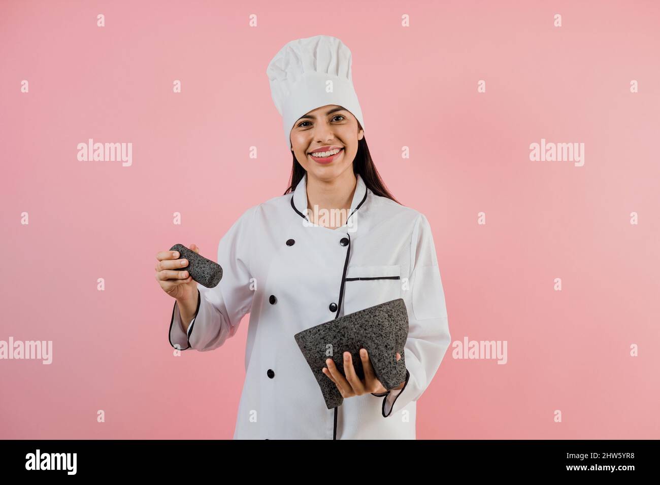 young latin woman wearing chef hat with ingredients on traditional ...