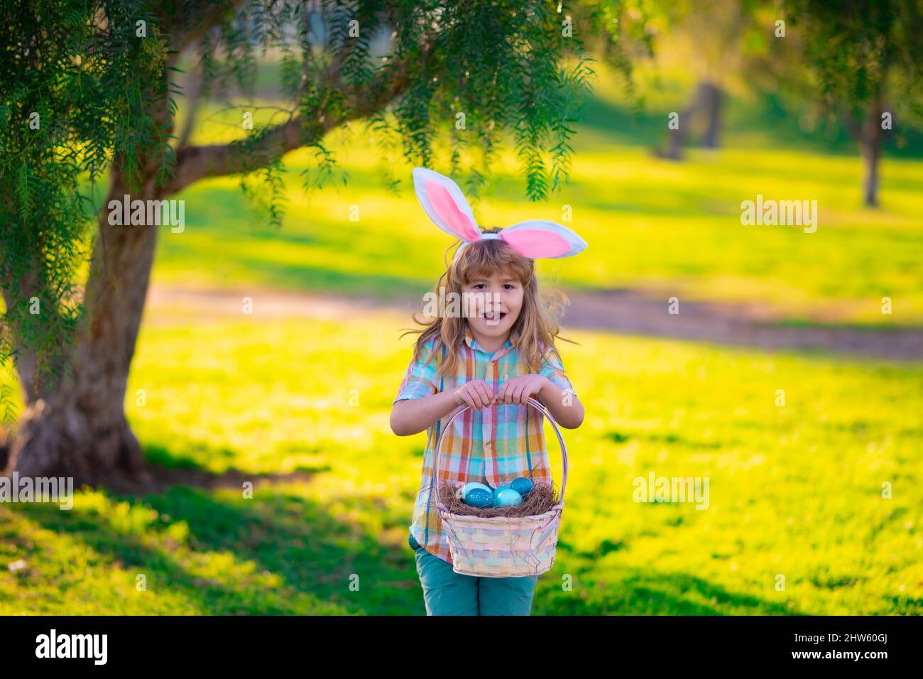 Bunny child. Easter bunny children. Kids boy in bunny ears hunting ...