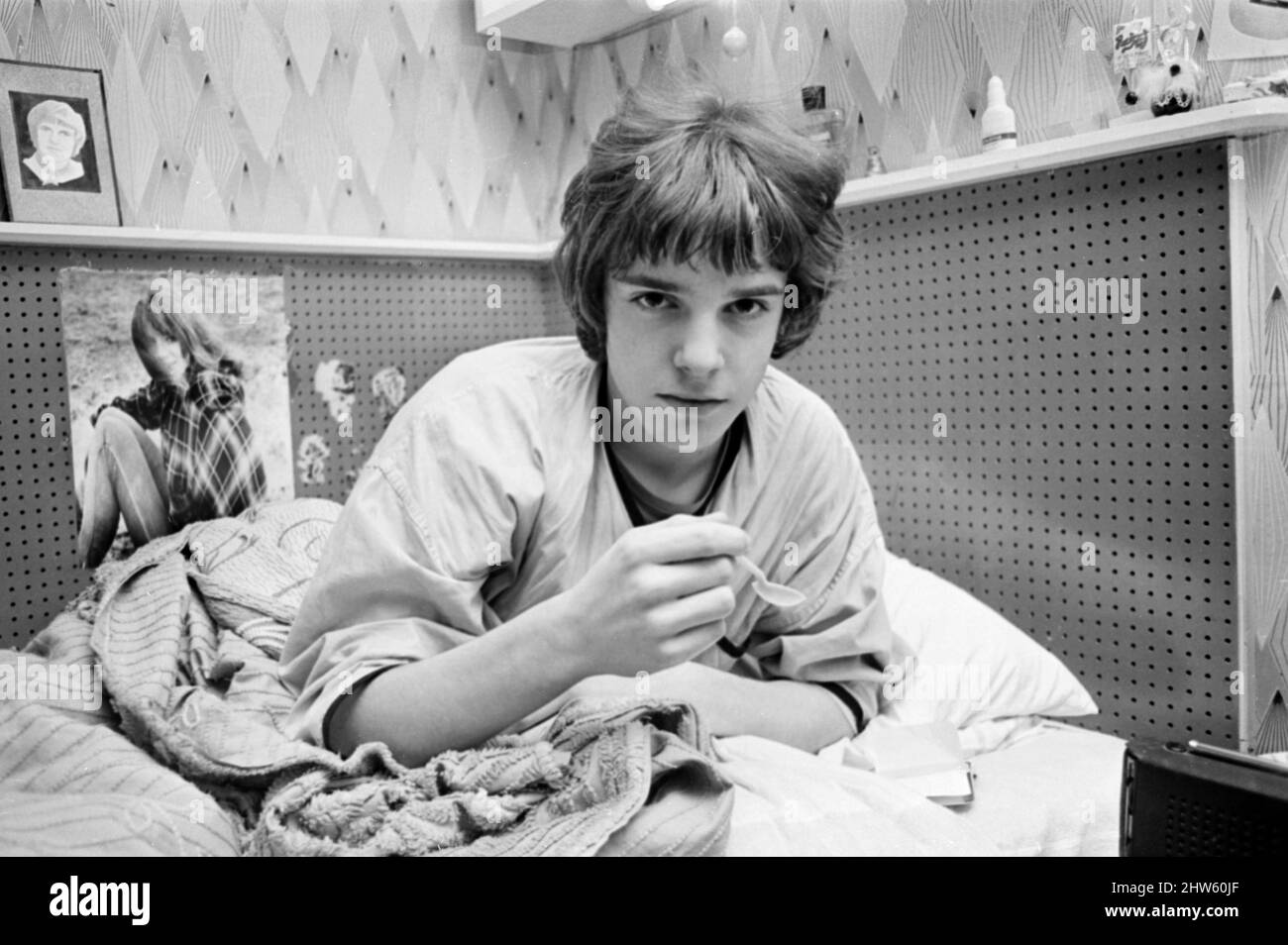 Rock singer Peter Frampton at home in bed with flu. Rock singer Peter ...