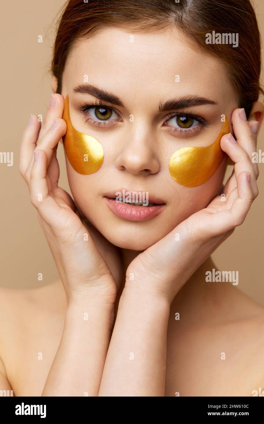 portrait woman golden patches on the face isolated background Stock ...