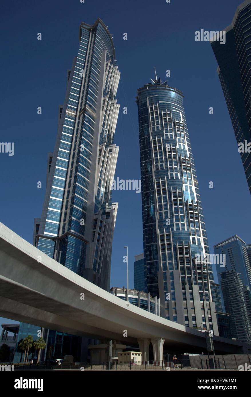 Vertical shot of two towers of the JW Marriott Marquis hotel under blue ...