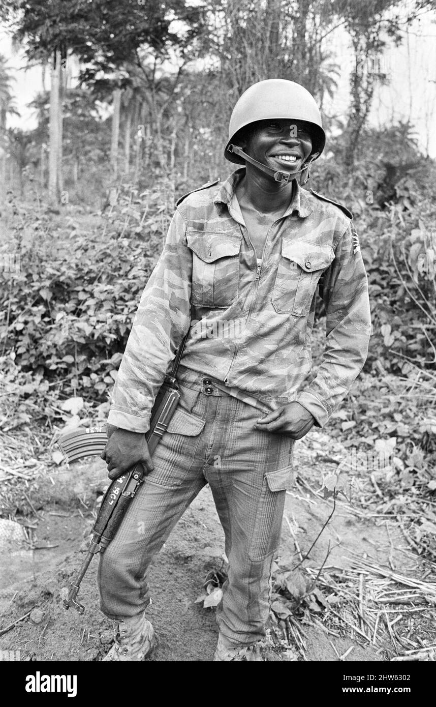 A Biafran soldier seen here in relaxed mood, armed with an AK47 semi automatic rifle during the ...