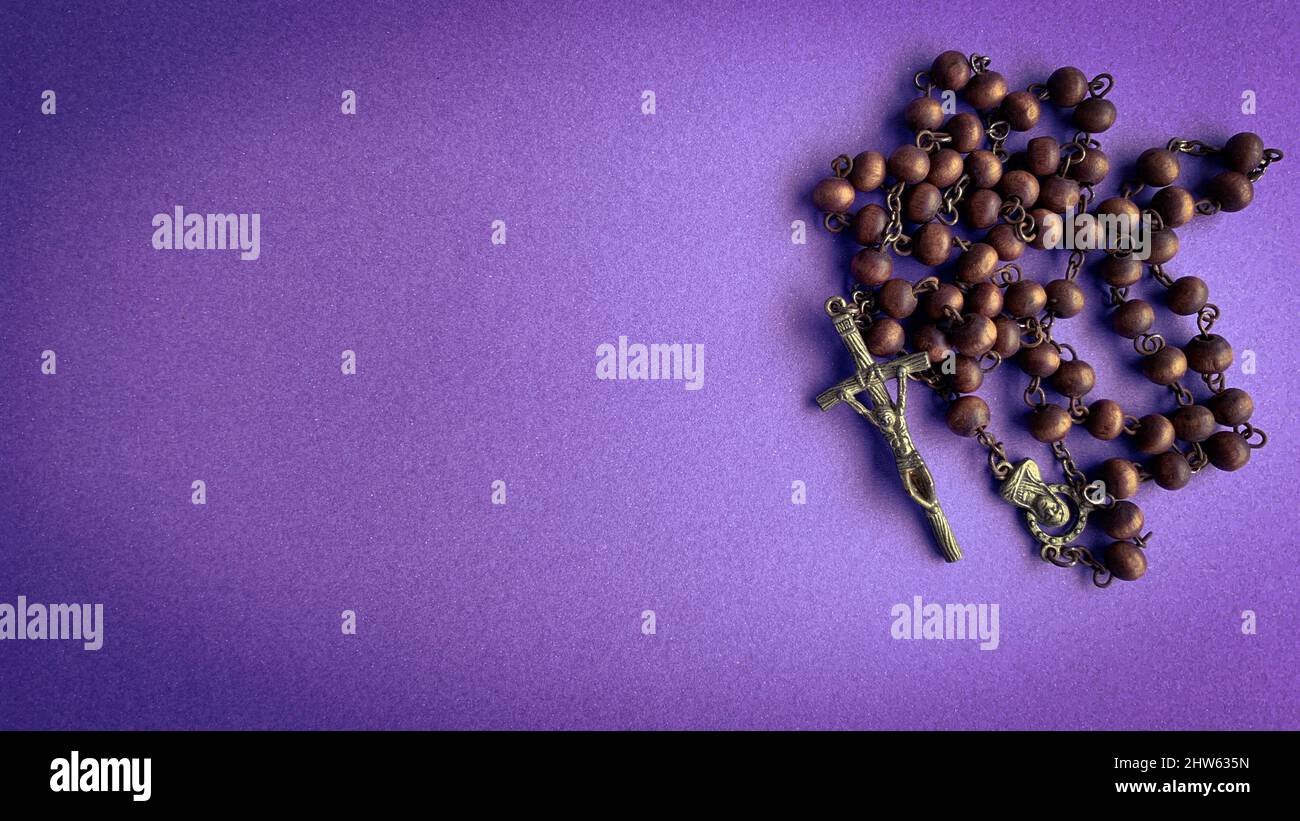 Top view of Holy Rosary on purple cover background Stock Photo - Alamy