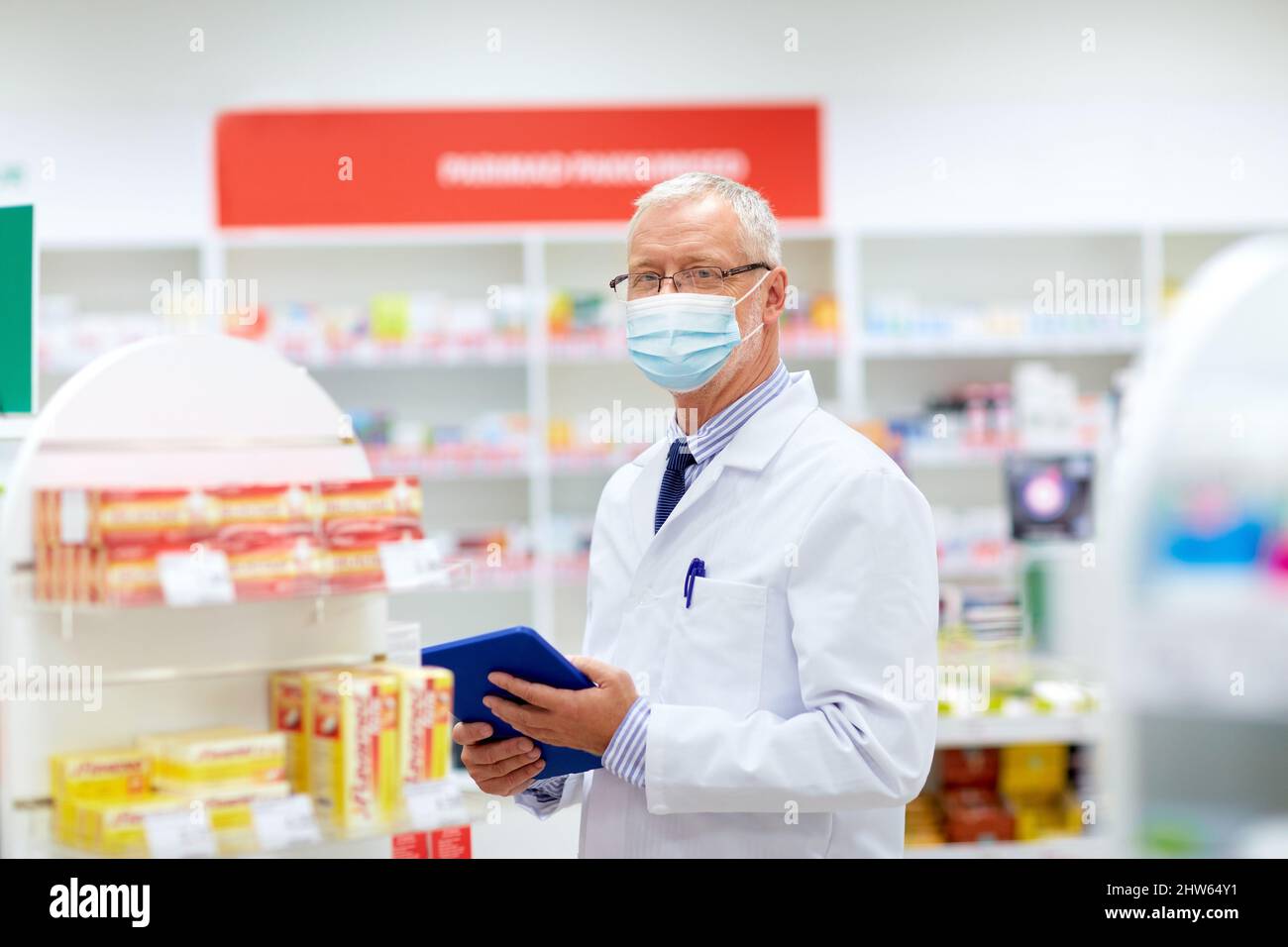 Senior apothecary in mask hi-res stock photography and images - Alamy
