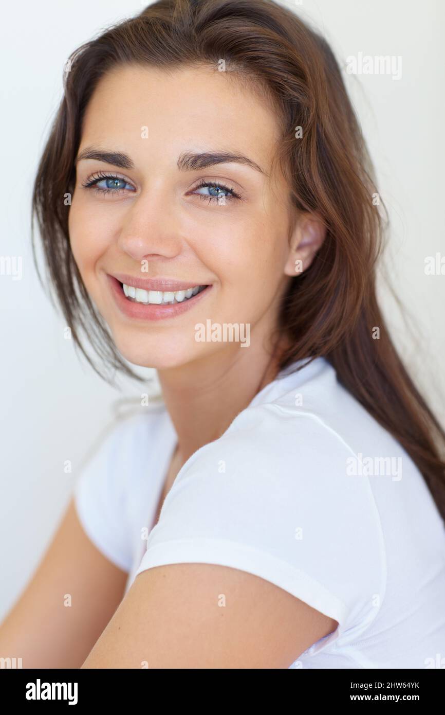 Genuine, sweet smile. Portrait of a stunning young woman with smooth ...
