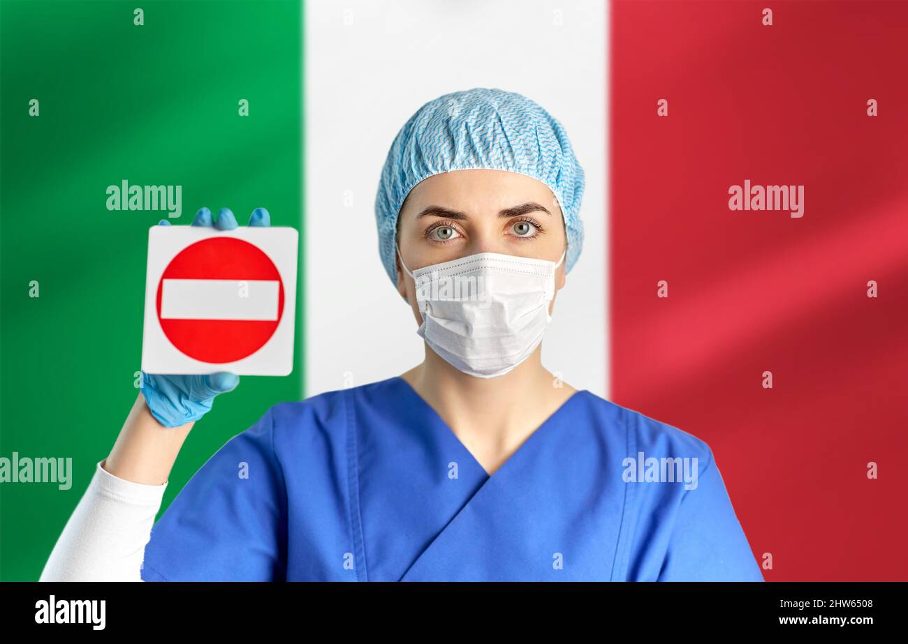 italian doctor or nurse in mask showing stop sign Stock Photo - Alamy
