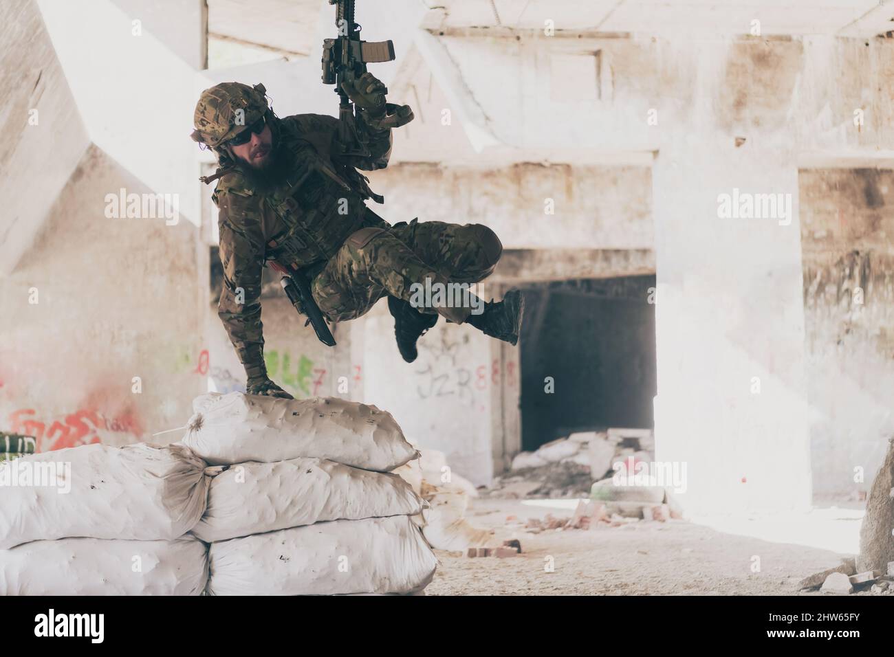 A bearded soldier in uniform of special forces in a dangerous military ...