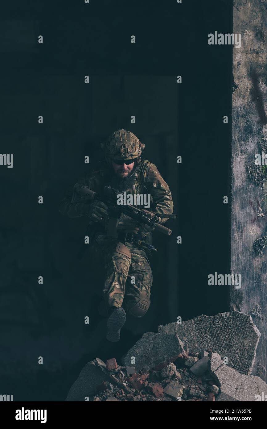 A bearded soldier in uniform of special forces in a dangerous military ...