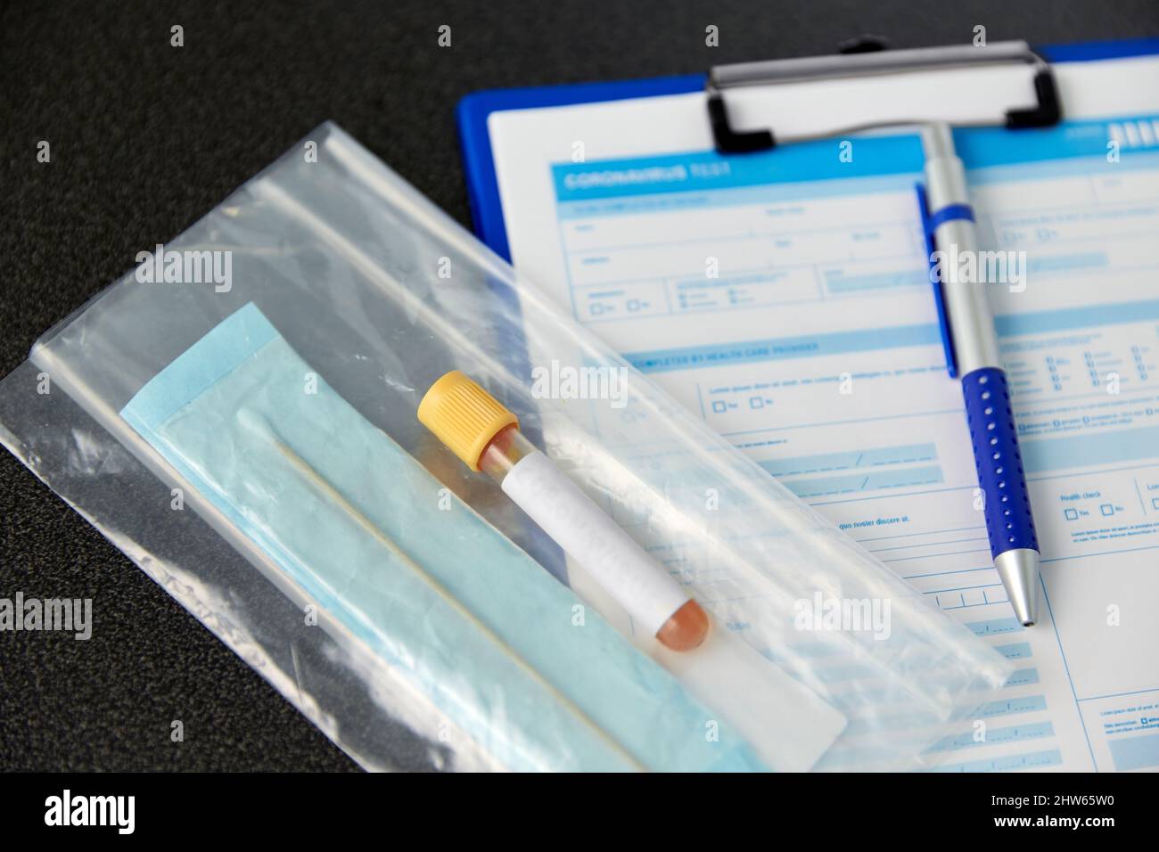 beaker with test, cotton swab and medical report Stock Photo - Alamy
