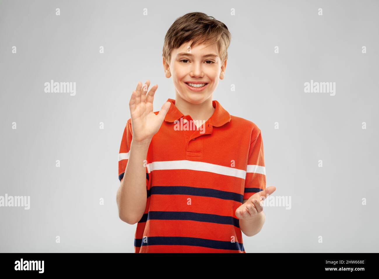 portrait of happy smiling boy applauding Stock Photo - Alamy