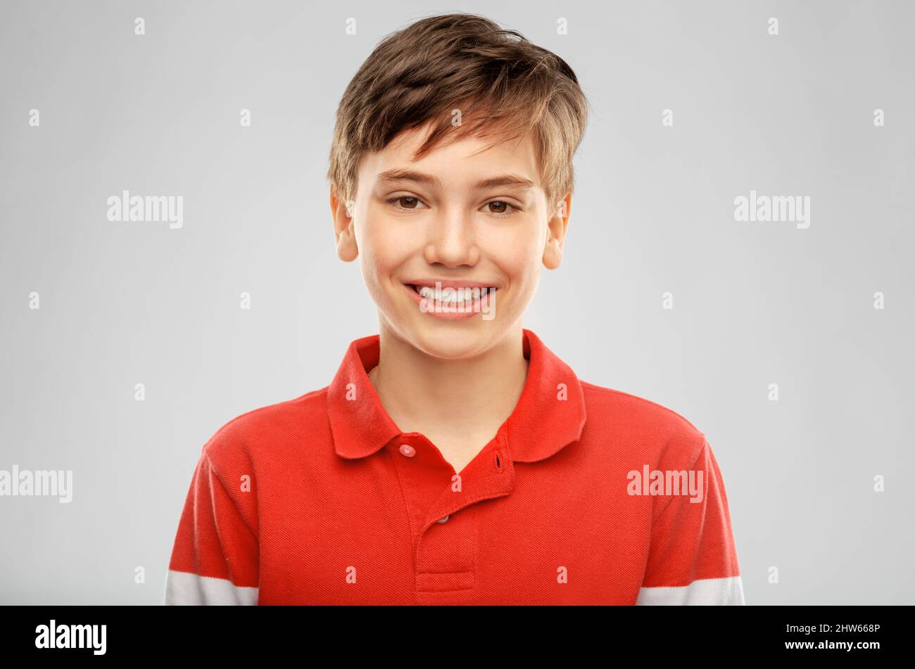 portrait of happy smiling boy in red polo t-shirt Stock Photo - Alamy