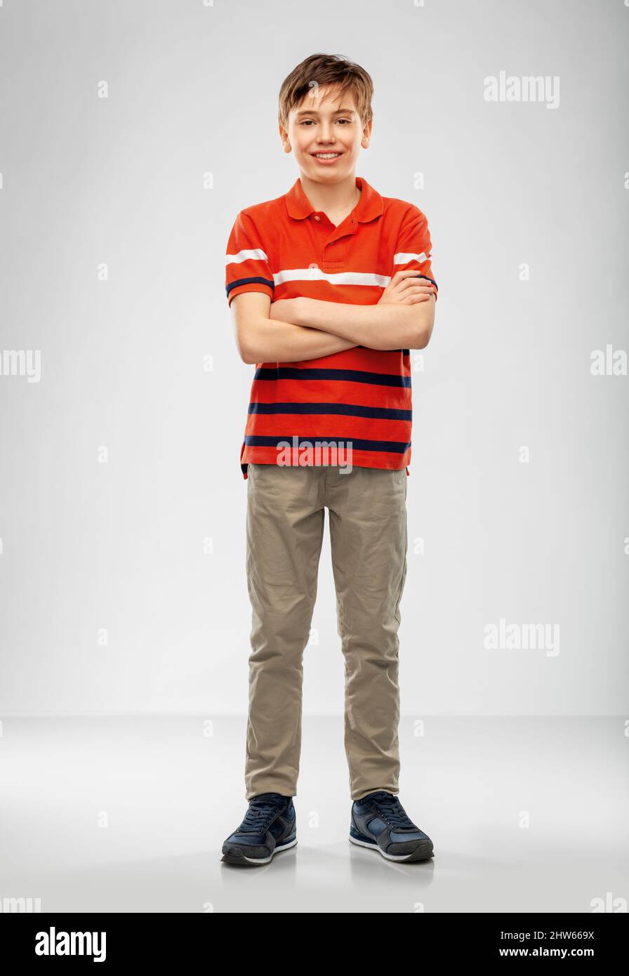 portrait of happy smiling boy in red polo t-shirt Stock Photo - Alamy