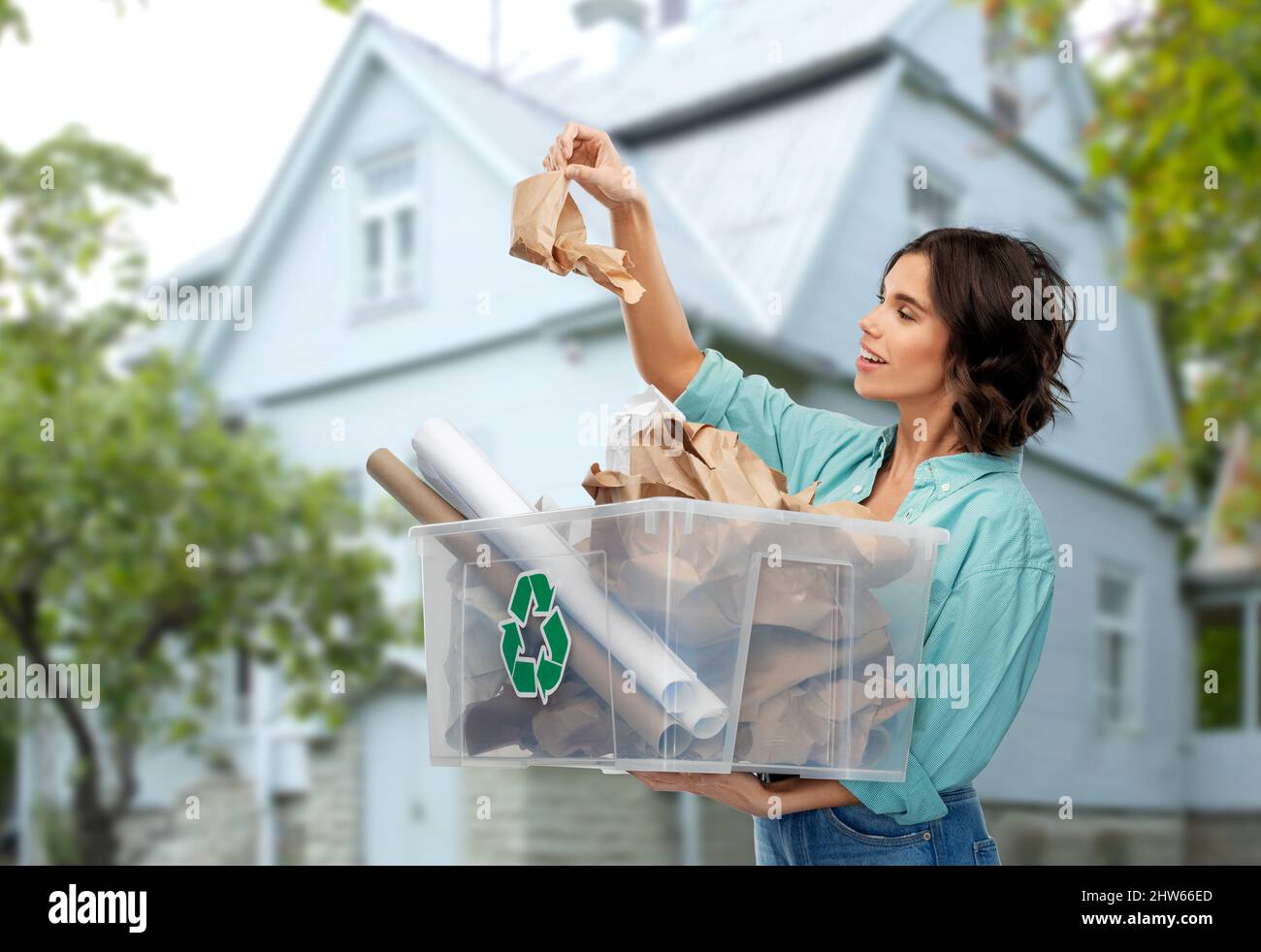 Happy young woman sorting hi-res stock photography and images - Alamy