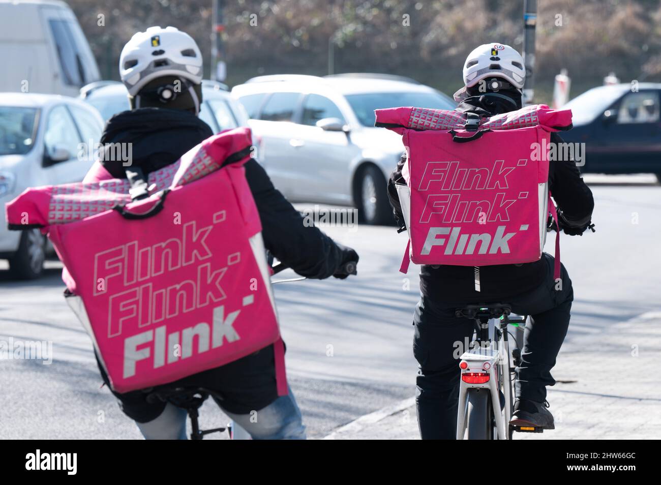 Dresden, Germany. 03rd Mar, 2022. Two bicycle couriers carry backpacks ...