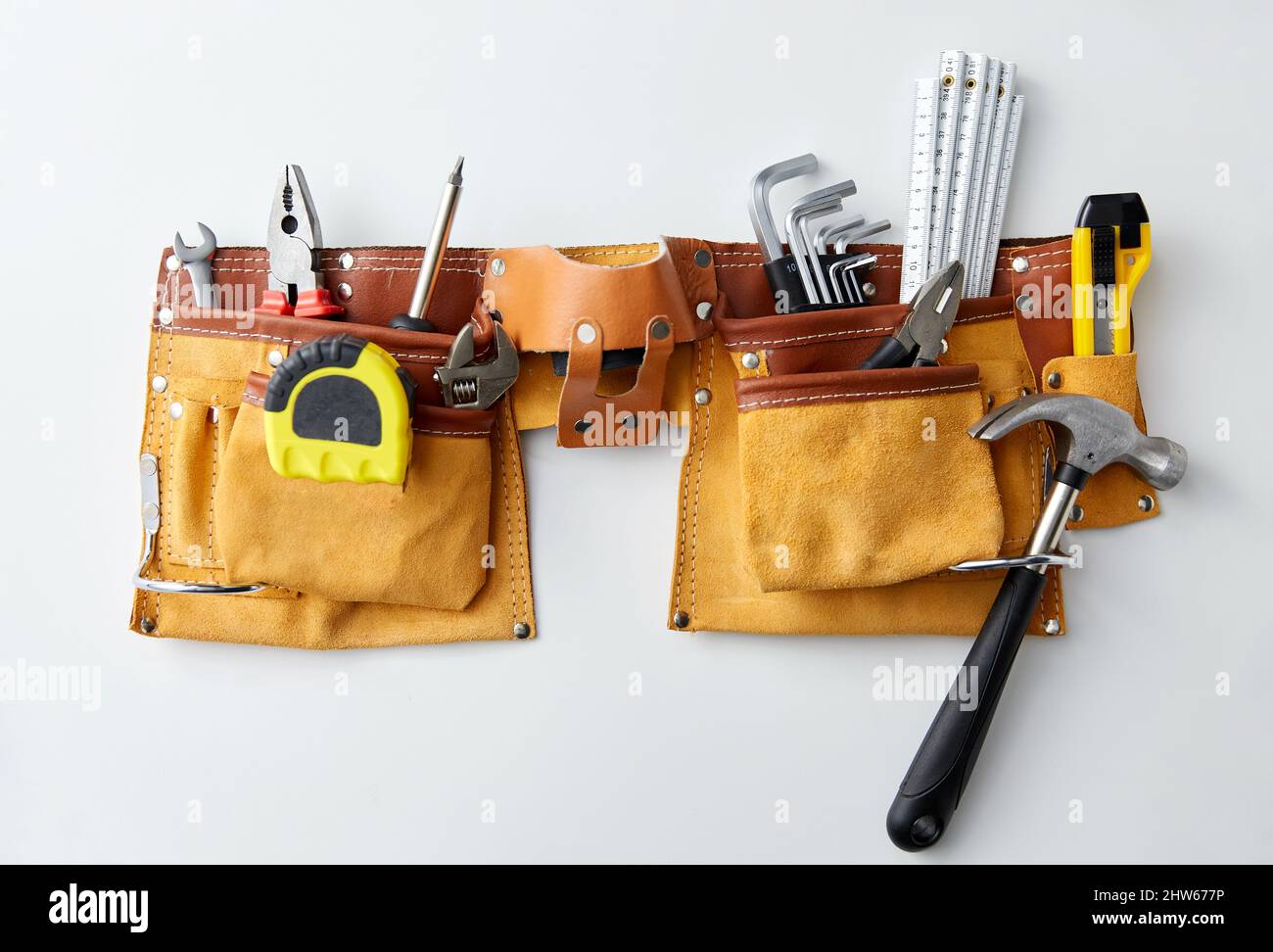 different work tools in belt on white background Stock Photo - Alamy