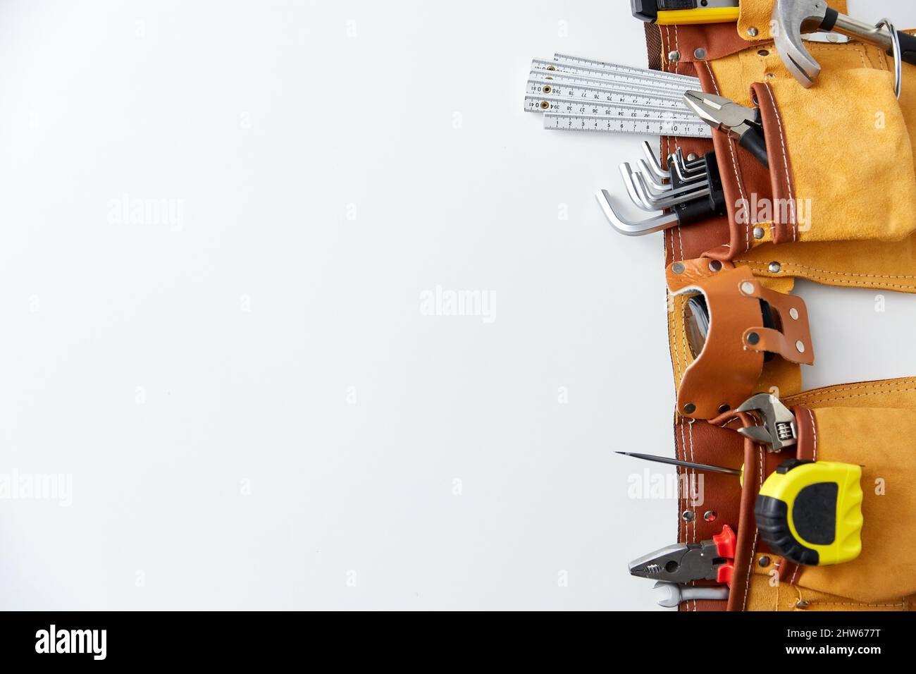different work tools in belt on white background Stock Photo - Alamy