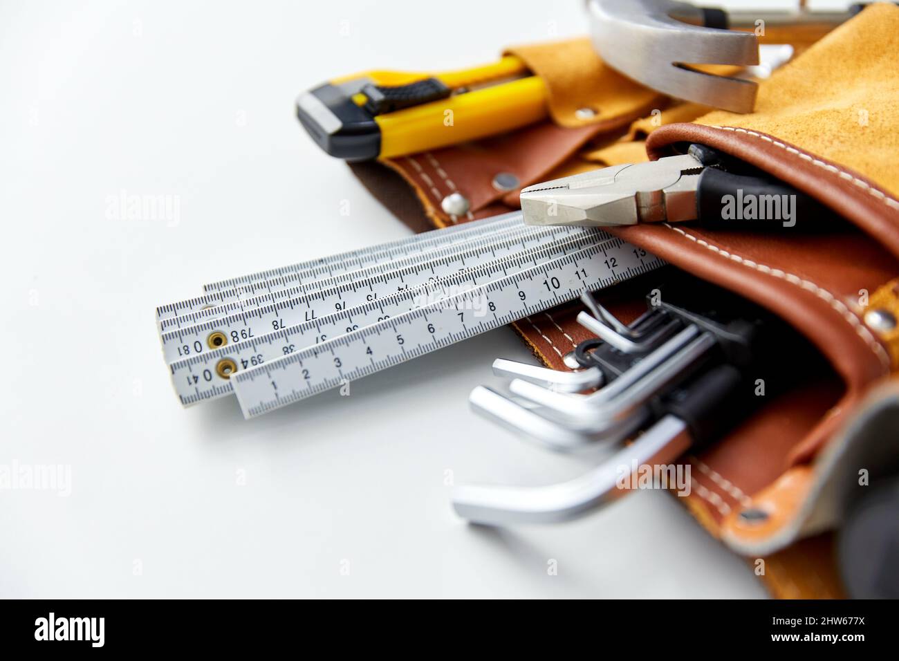 different work tools in belt on white background Stock Photo - Alamy