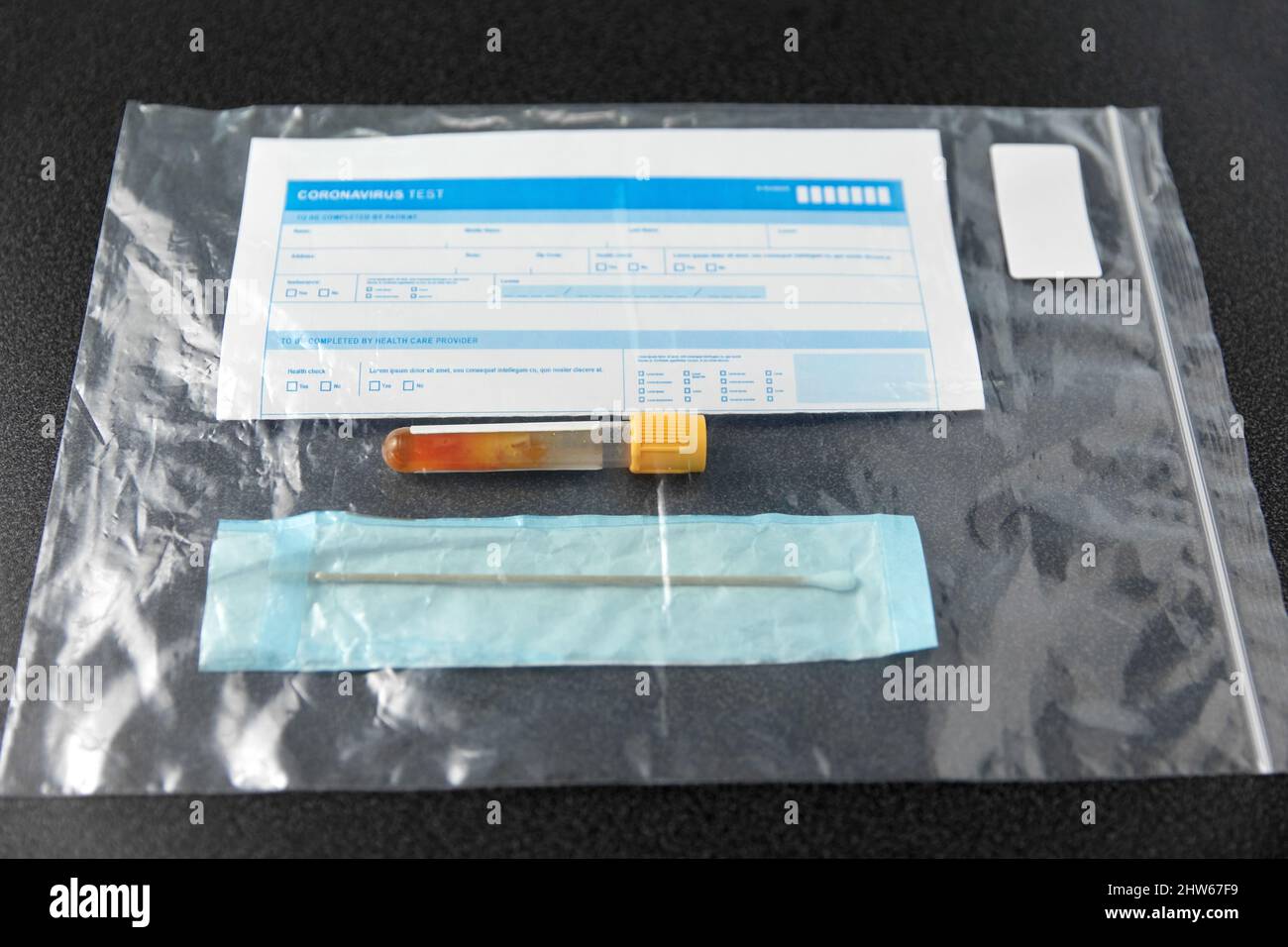 beaker with test, cotton swab and medical report Stock Photo - Alamy
