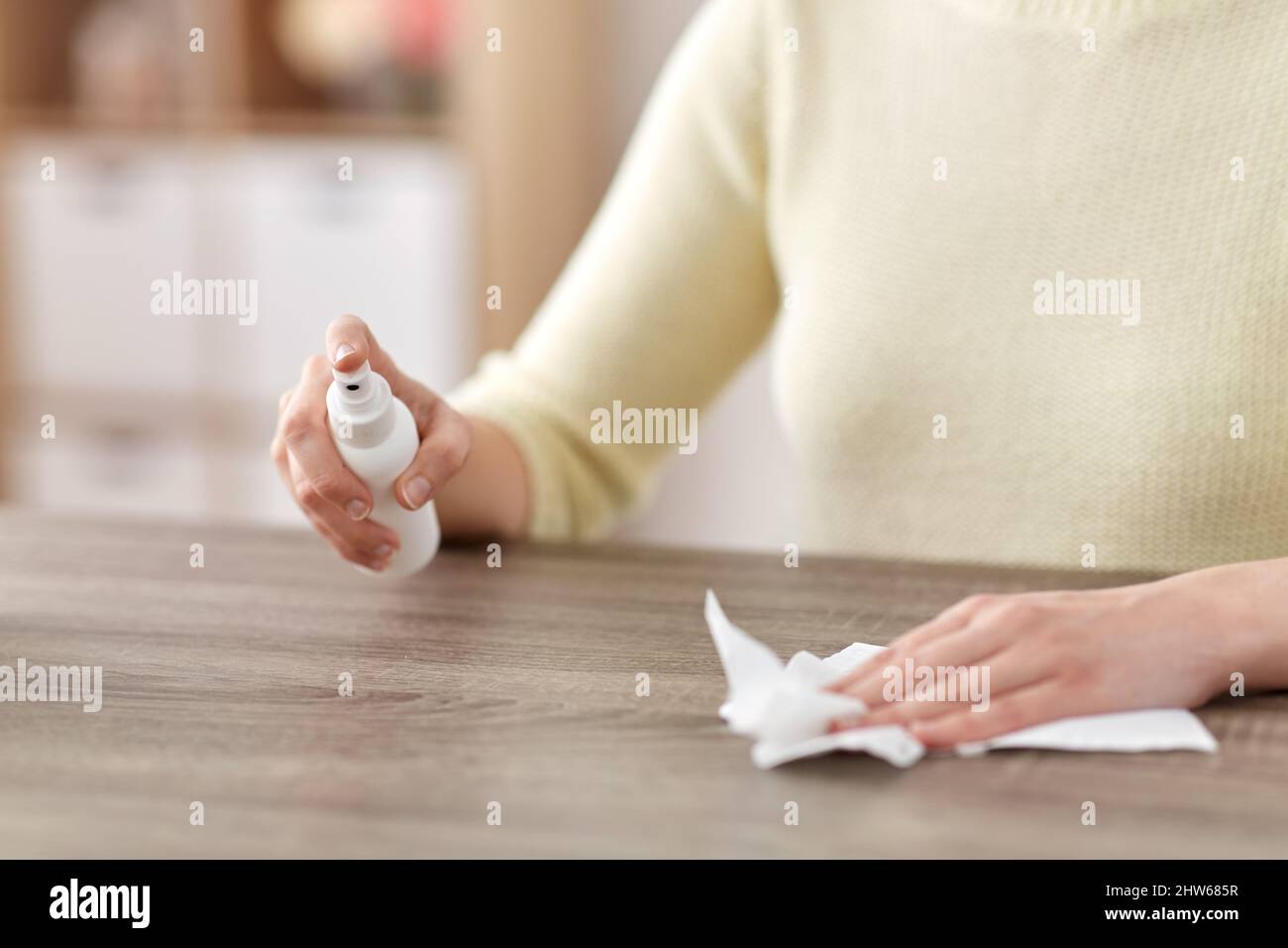 Woman wipe table spray hi-res stock photography and images - Alamy