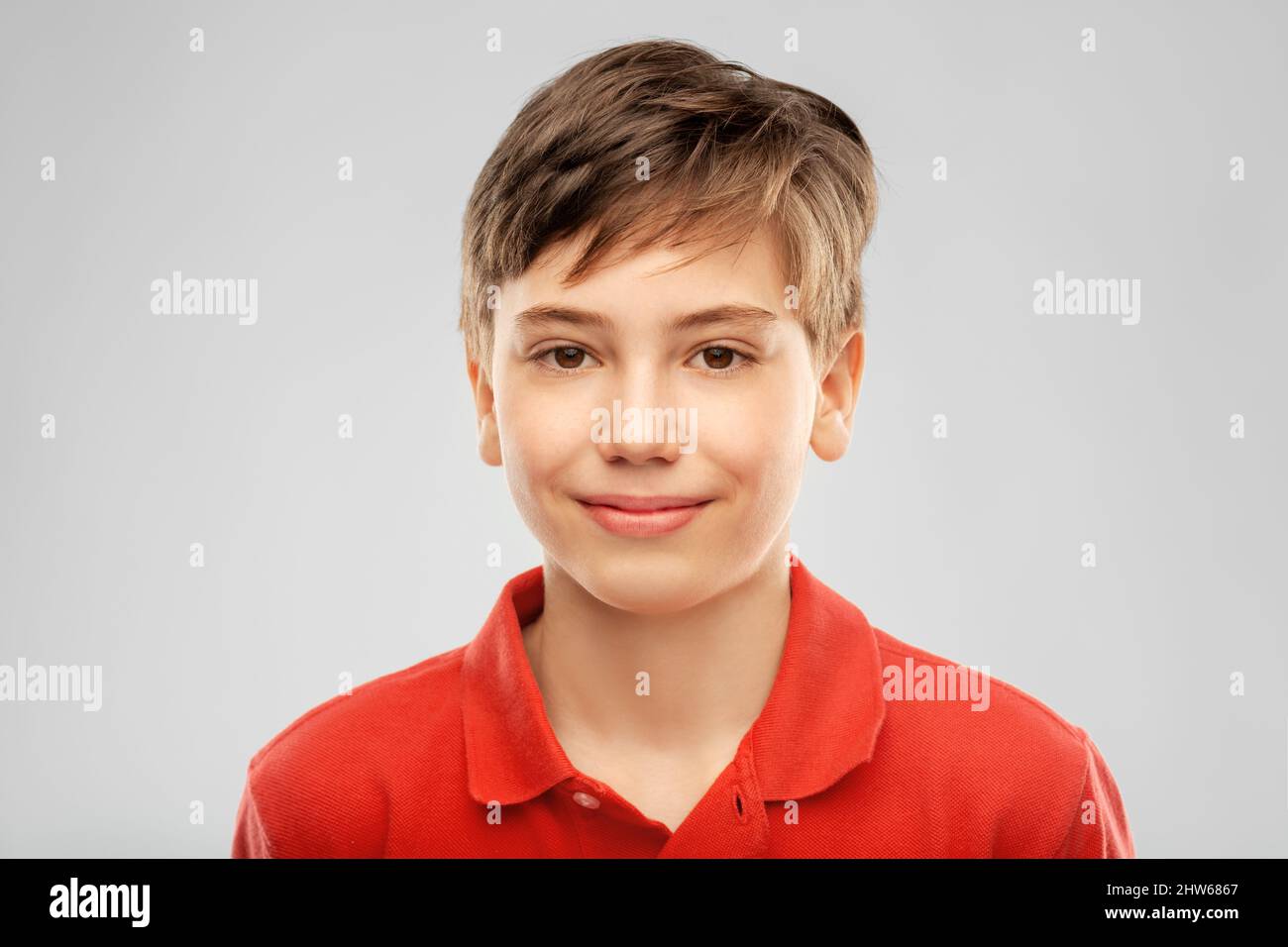 portrait of happy smiling boy in red polo t-shirt Stock Photo - Alamy