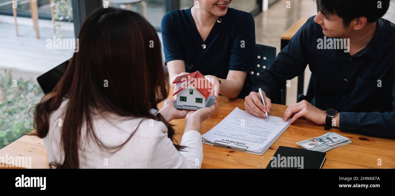 Real estate agent offer hand for customer sign agreement contract ...