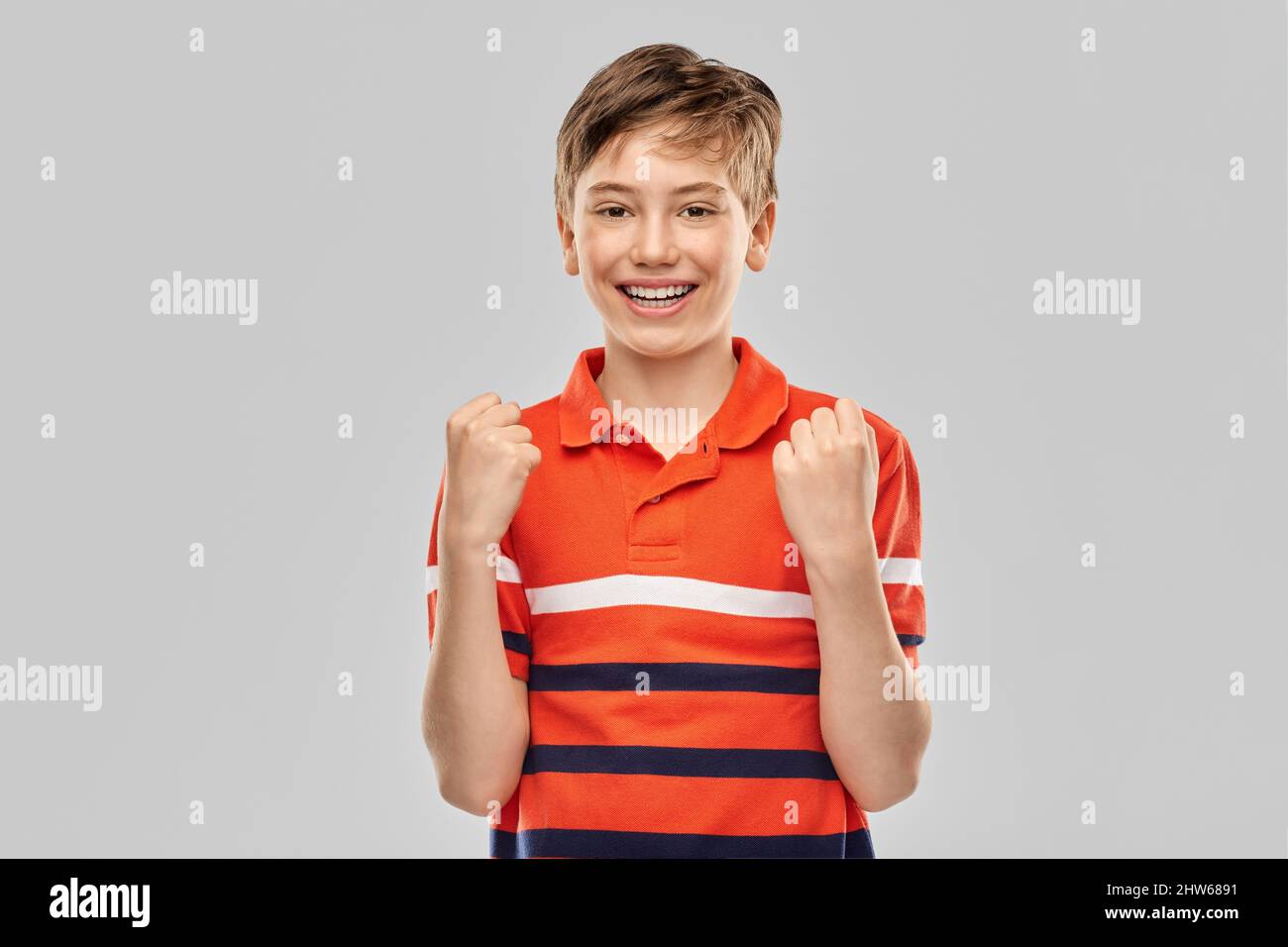 portrait of happy smiling boy celebrating success Stock Photo - Alamy