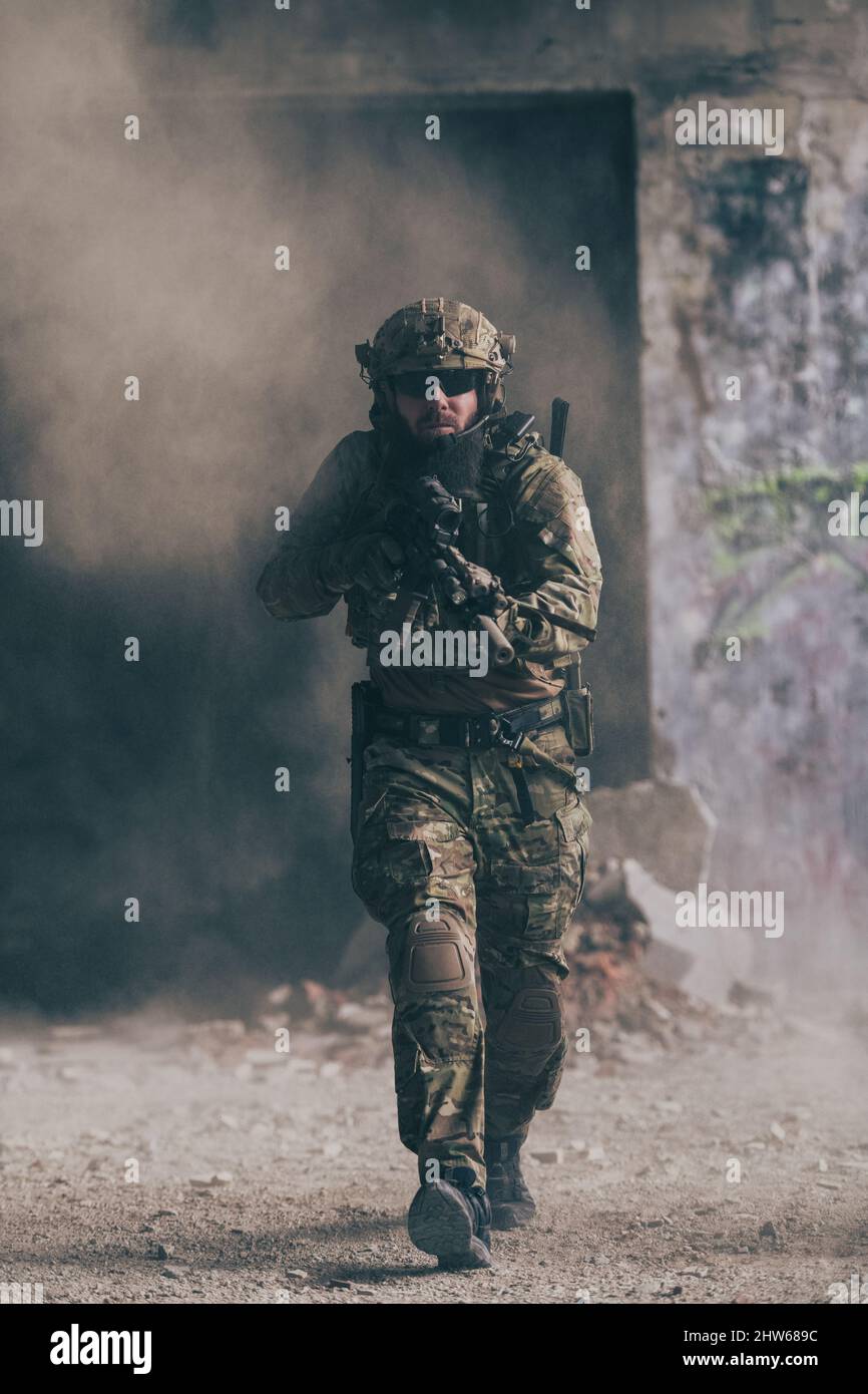 A bearded soldier in uniform of special forces in a dangerous military ...