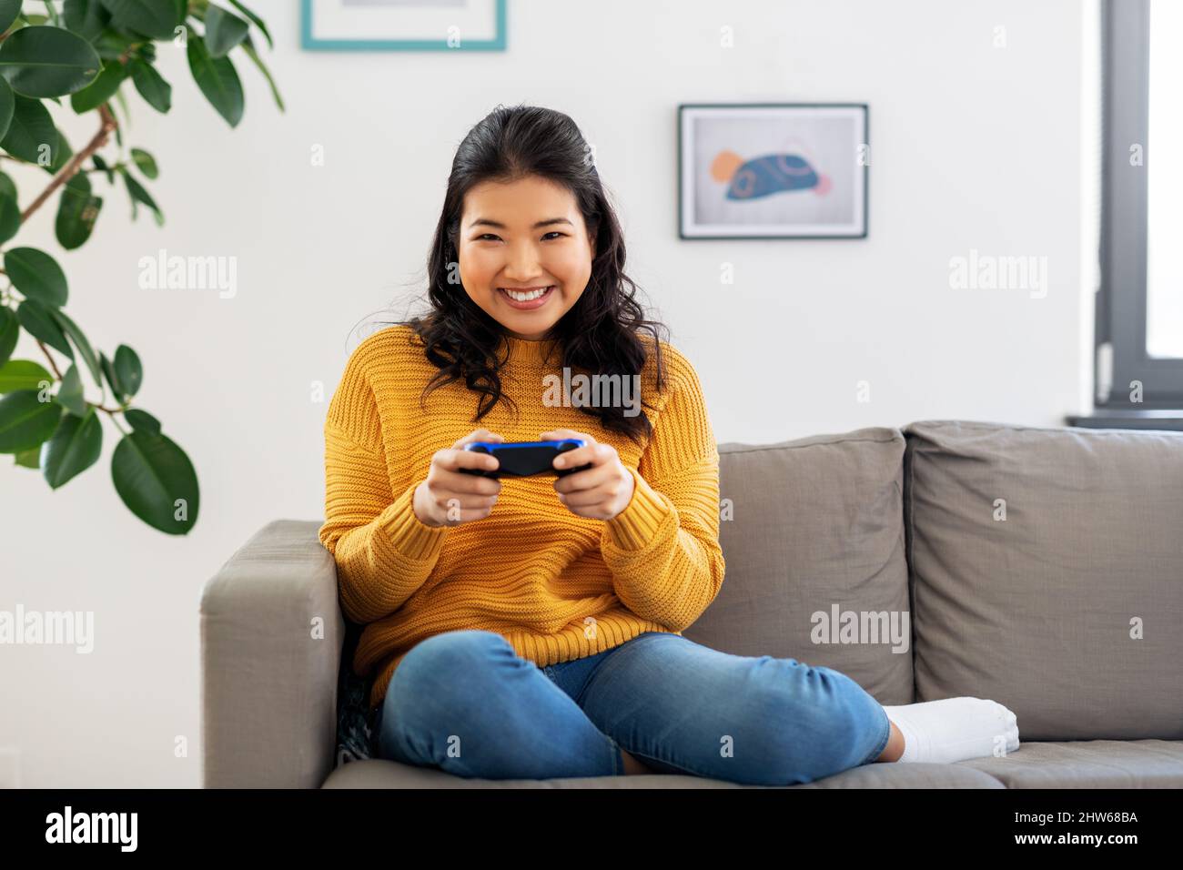 Beautiful asian woman playing computer hi-res stock photography and ...