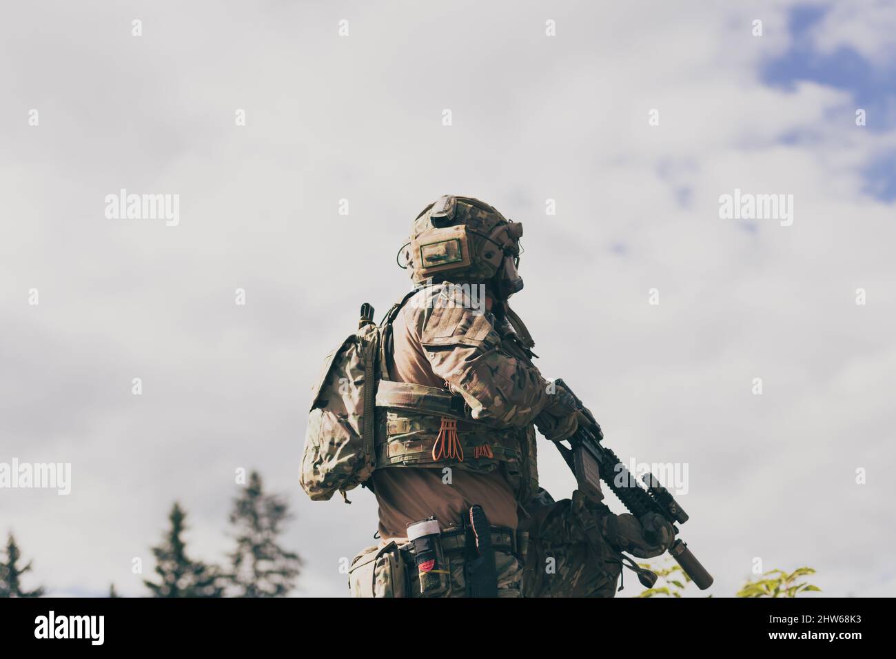 War concept. A bearded soldier in a special forces uniform fighting an ...