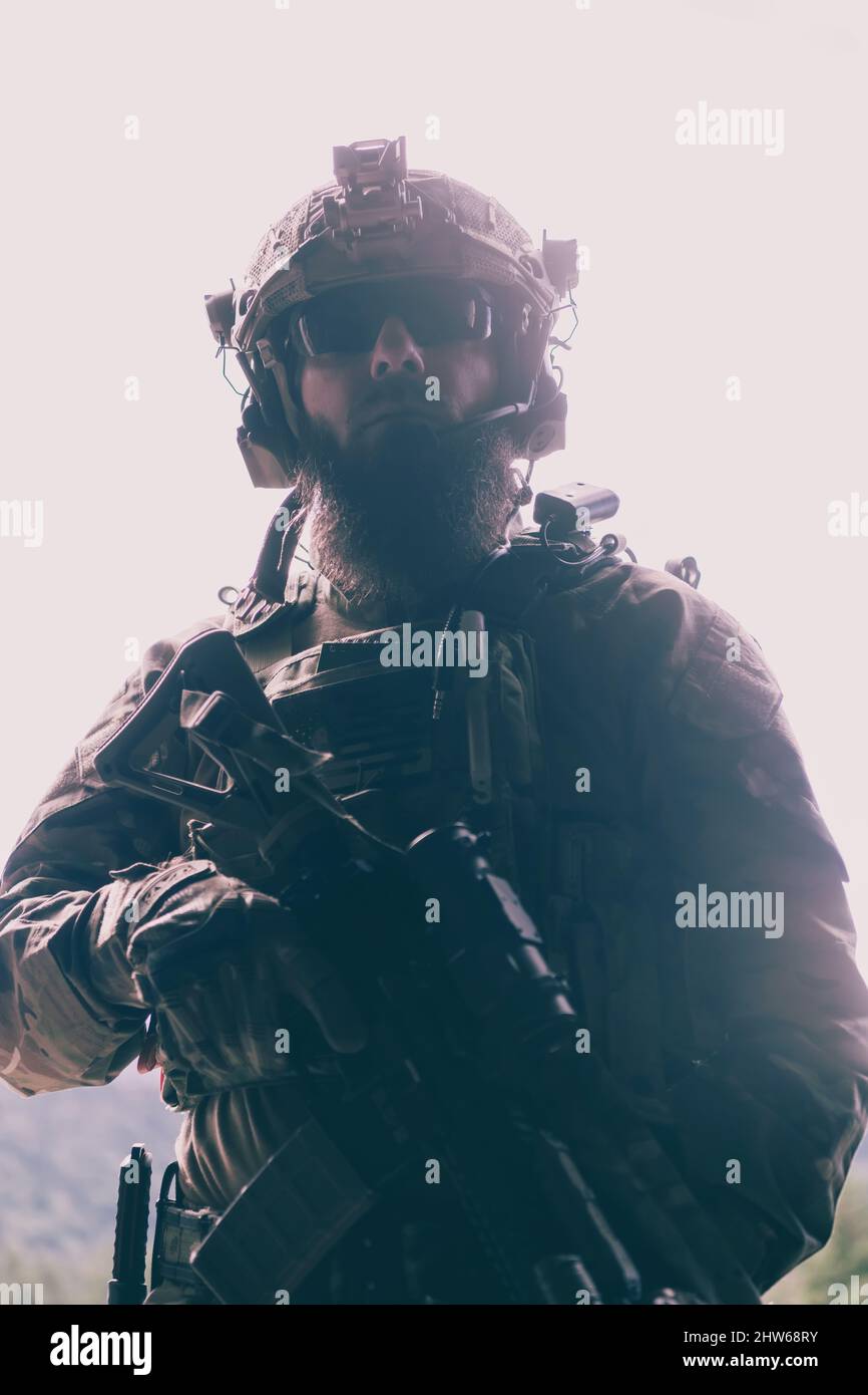 War concept. A bearded soldier in a special forces uniform fighting an ...