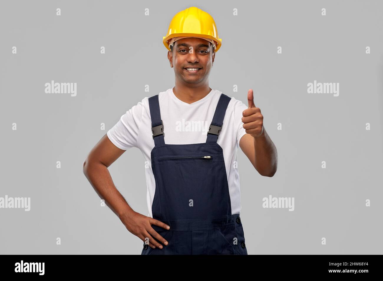 happy indian worker or builder showing thumbs up Stock Photo - Alamy