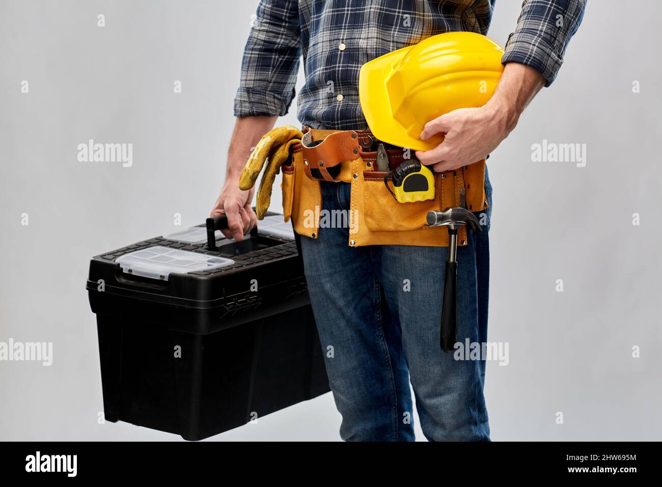 builder with helmet and box of working tools Stock Photo - Alamy