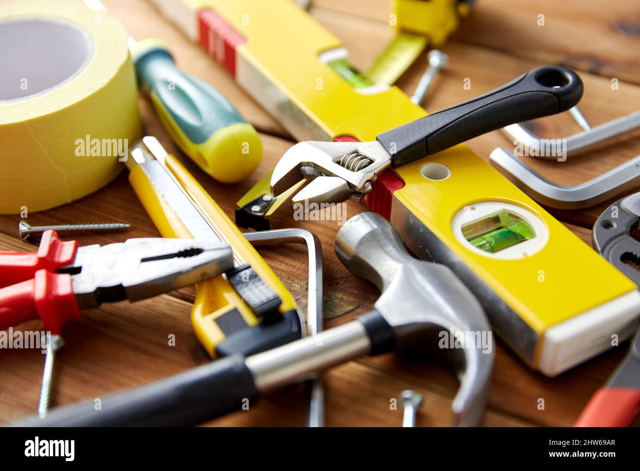 different work tools on wooden boards background Stock Photo - Alamy