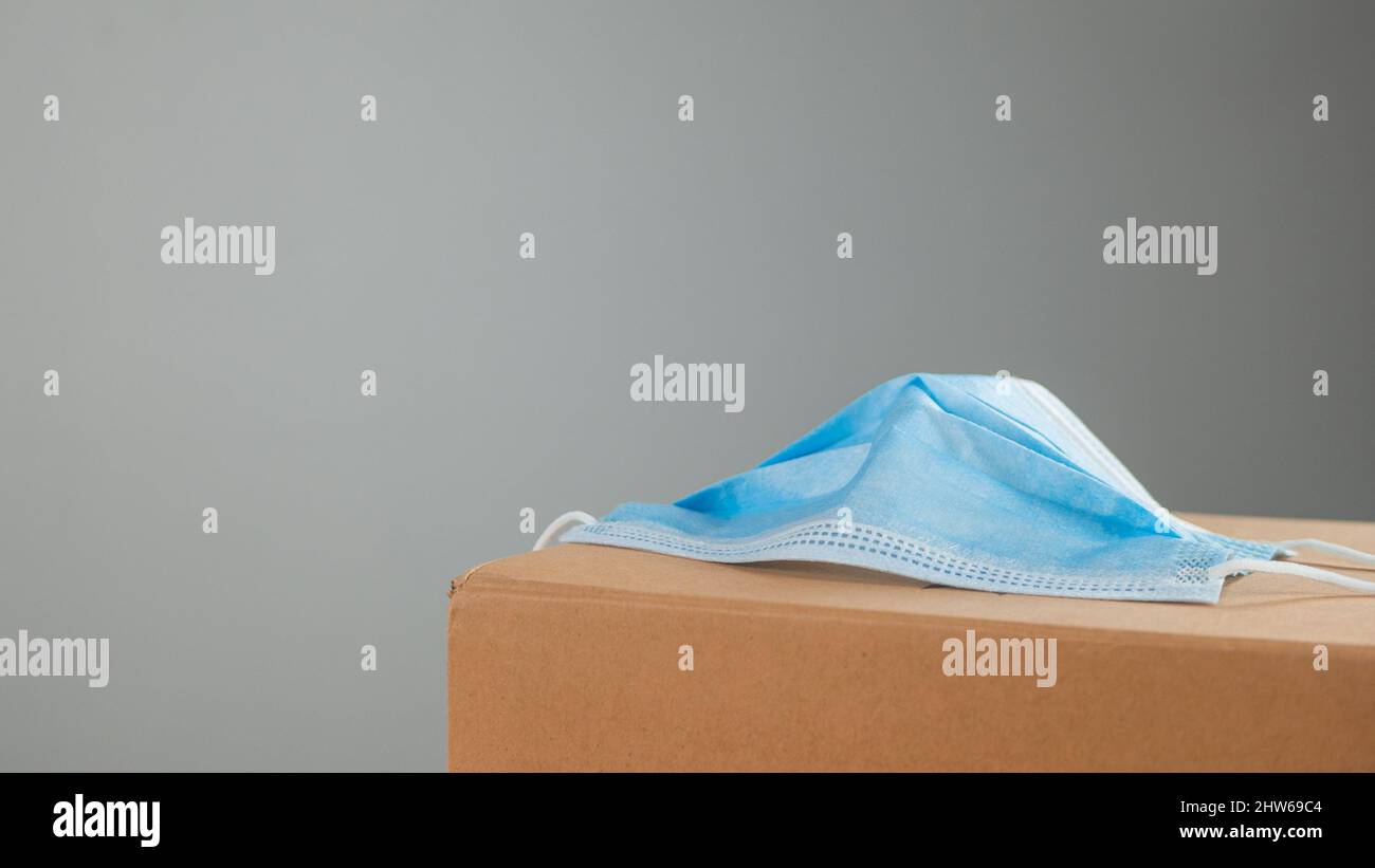 Medical concept. Giving a blue mask to someone for disease protection ...